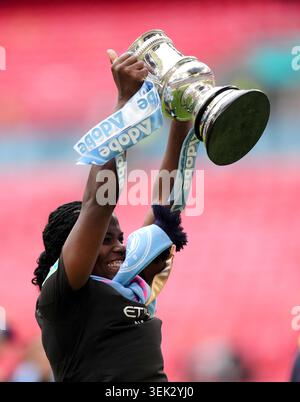 Khadija Shaw of Manchester City lifts the trophy after winning the ...