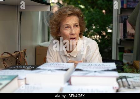 Author Julia Navarro signs copies of her books during the 85th edition ...