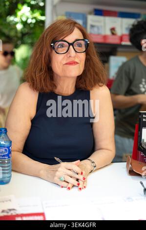 Author Elvira Lindo signs copies of her books during the 85th edition ...