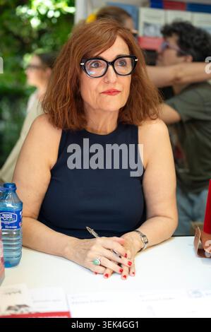 Author Elvira Lindo signs copies of her books during the 85th edition ...