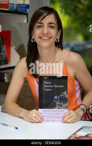 Author Marta Jimenez signs copies of her books during the 85th edition ...