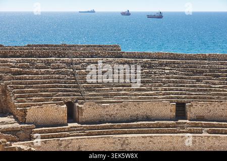Roman amphitheater in Tarragona coastline. Mediteranean beach in ...