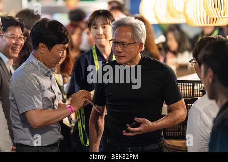 Jensen Huang, President and CEO of NVIDIA handing out food to fans ...