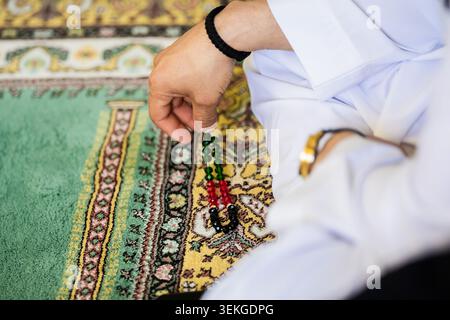 PRODUCTION - 27 May 2026, Berlin: A believer prays on a prayer mat ...