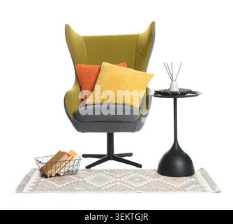 Armchair with cushions, side table, books and decor isolated on white ...