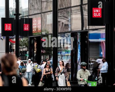UNIQLO logo is seen as people walk in front of the shop on landmark ...