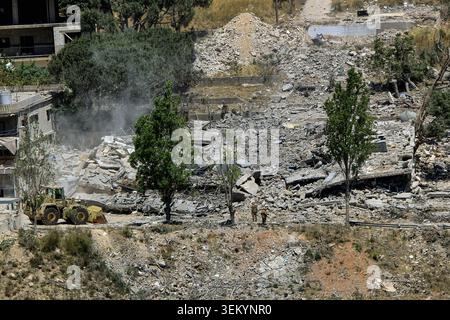 The southern town of Khiam, Lebanon, is seen through a fence near the ...