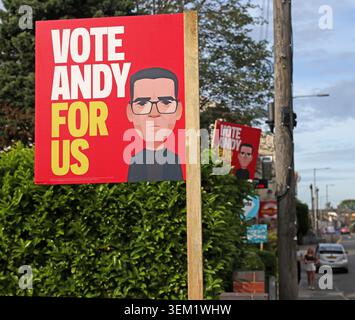 Labour Vote Andy For Us poster with Reform UK sign in an Ashton-in ...