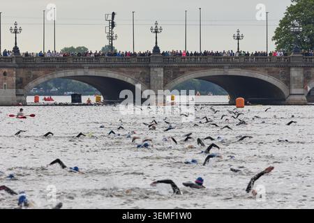 Participants swim after the start of the triathlon European ...