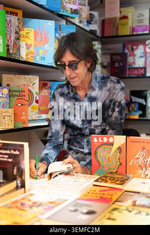 Benjamin Prado signs copies of her books during the 85th edition of the ...