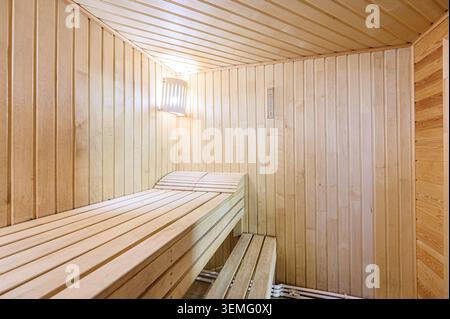 modern luxury sauna interior featuring multi-tier wooden benches and ...