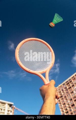 Outdoor Badminton Game in Urban Environment Under Blue Sky. High ...