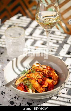 Savoring a Delicious Seafood Dish at a Cozy Restaurant With Natural ...