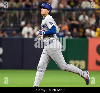 Los Angeles Dodgers designated hitter Shohei Ohtani (17) is greeted by ...