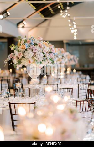 Elegant wedding table with pastel floral centerpiece outdoors Stock ...