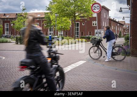 HOUTEN - A street with a traffic sign indicating a maximum speed of 20 ...