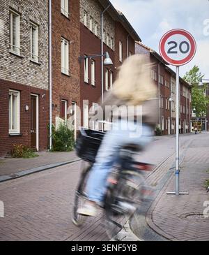 HOUTEN - A street with a traffic sign indicating a maximum speed of 20 ...