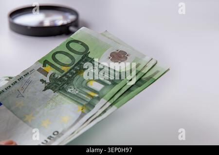 Euro Banknotes with Magnifying Glass Representing Financial Audit and ...