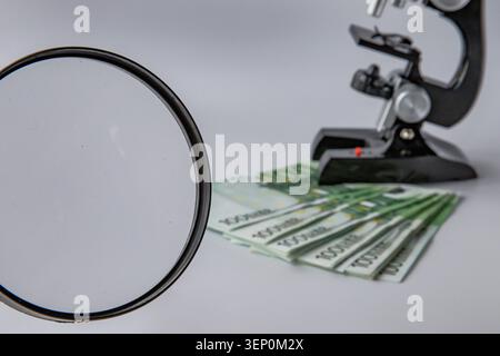 Euro Banknotes with Magnifying Glass Representing Financial Audit and ...