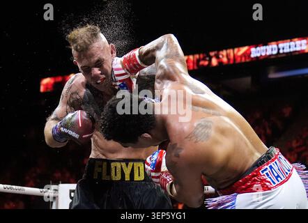 Eddie Hall (right) lands a punch on Tommy Fury during their Heavyweight ...