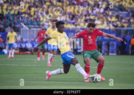 Vinicius Junior of Brazil competes for the ball with Carlens Arcus of ...