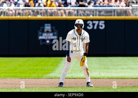 West Virginia utility Armani Guzman (5) hits the ball foul an NCAA ...
