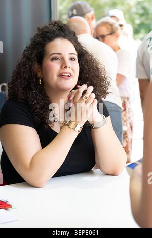 Madrid, Spain. 14th June, 2026. Ana Lena Roviera signs copies of her ...