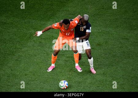 Guela Doue of Cote d'Ivoire competes for the ball with Enner Valencia ...