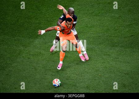 Guela Doue of Cote d'Ivoire competes for the ball with Enner Valencia ...