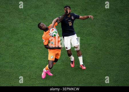 Nicolas Pepe of Cote d'Ivoire competes for the ball with Pedro Vite of ...