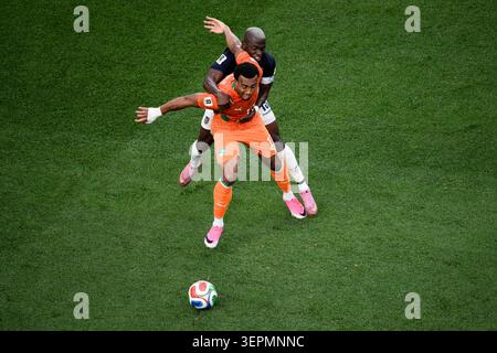 Guela Doue of Cote d'Ivoire competes for the ball with Enner Valencia ...