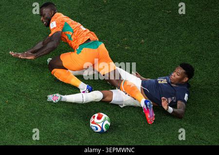 Ghislain Konan (R) of Cote d'Ivoire is tackled by Gonzalo Plata of ...