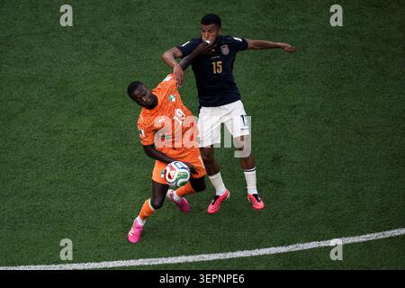 Nicolas Pepe of Cote d'Ivoire competes for the ball with Pedro Vite of ...