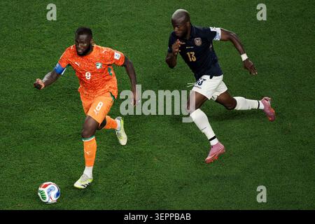 Franck Kessie of Cote d'Ivoire competes for the ball with Enner ...