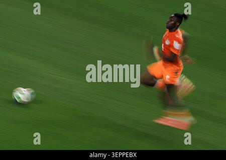 Wilfried Singo of Cote d'Ivoire runs with the ball during the FIFA ...