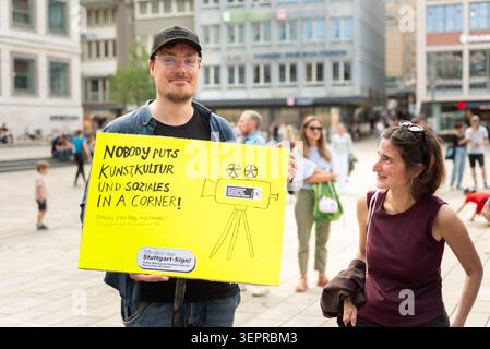 Stuttgart, Germany. 6 Jun 2026. A man carries a ver.di trade union flag ...