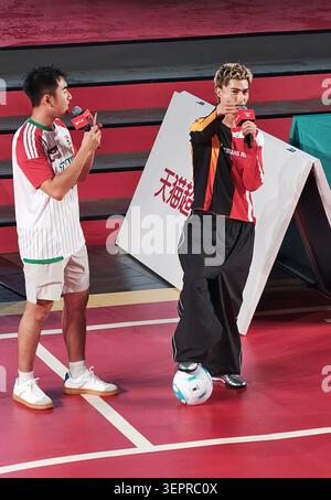 Singer Mika Hashizume teaches fans how to play soccer at Tmall World ...