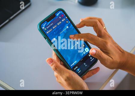 Balikpapan, Indonesia - May 31 2026. A vertical close-up shot of hands ...