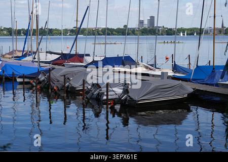 Hamburg, Germany. 16th June, 2026. Passersby are enjoying the sunny ...