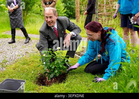 The Duke of Edinburgh plants a rose during a visit to Barnard Castle ...
