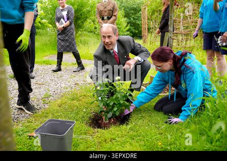 The Duke of Edinburgh plants a rose during a visit to Barnard Castle ...