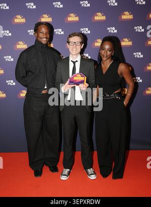Akinola Davies Jr. (left) and Corinna Brown (right) with Ash Williams ...