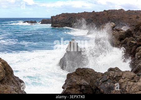 Heavy seas breaking on volcanic rocks at El Golfo on the south west ...
