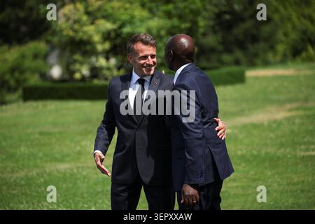 French President Emmanuel Macron (left) and Kenyan President William ...