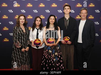 Barbara Broccoli (left) and Jason Isaacs (right) with the winners of ...