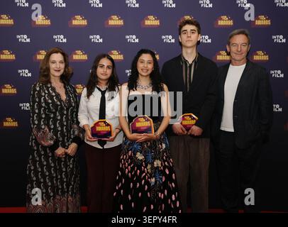 Barbara Broccoli (left) and Jason Isaacs (right) with the winners of ...