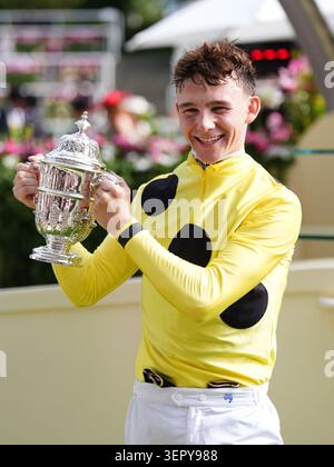 Winning jockey Billy Loughnane celebrates with the trophy after Bow ...