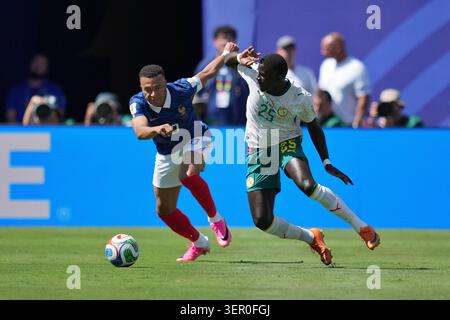 El Hadji Malick Diouf of Senegal is challenged by Jules Kounde of ...