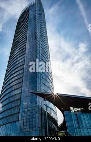 Modern building stands tall under bright blue sky in singapore Stock ...