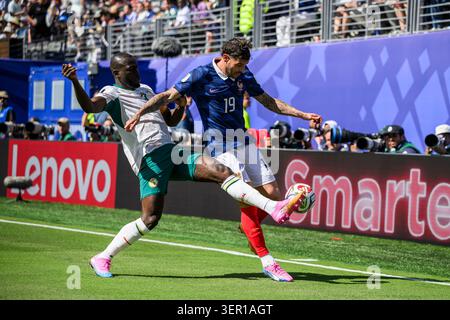 Theo Hernandez of France competes for the ball with Kalidou Koulibaly ...